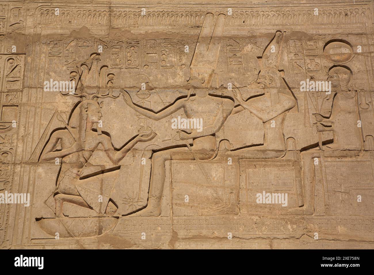 Pharaoh on left, God Atum in center, Reliefs, Ramesseum, Memorial ...