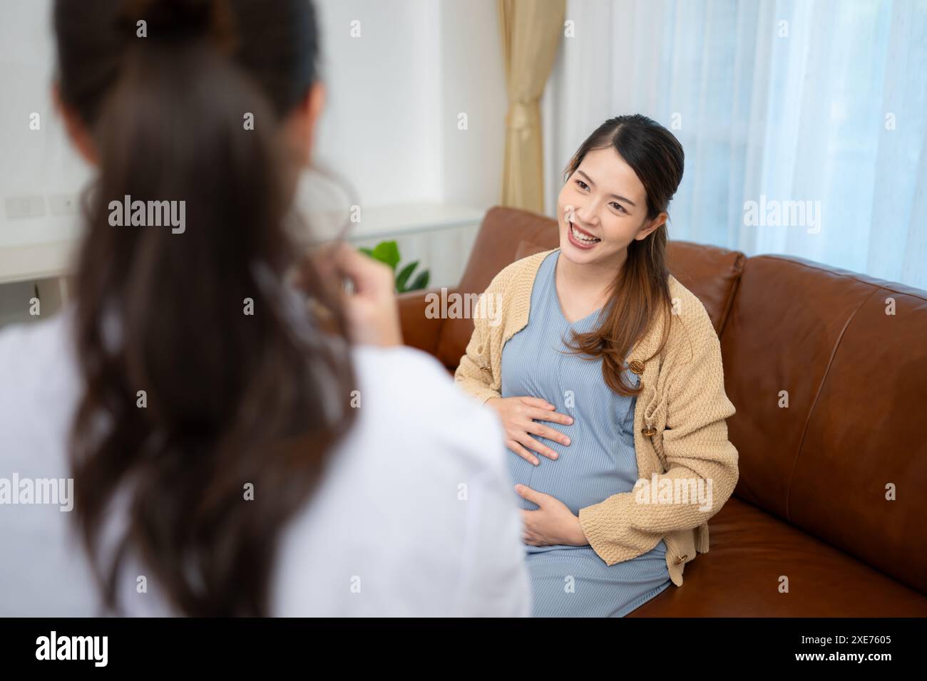 Father and daughter pregnant woman visit gynecologist doctor at medical ...