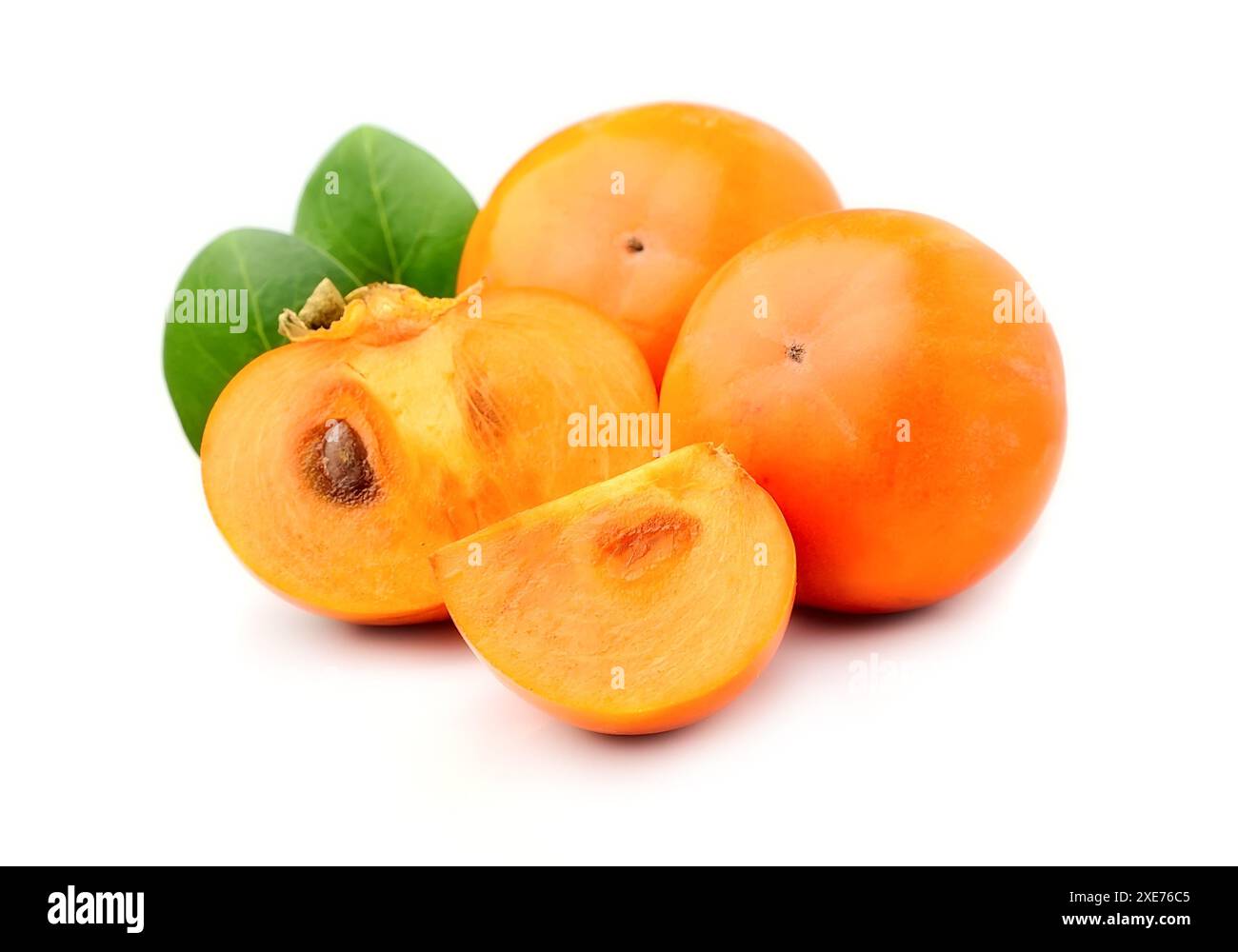 Persimmon fruits with leaves Stock Photo - Alamy