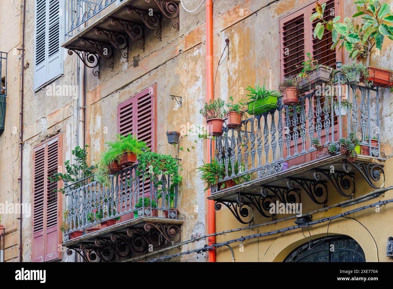 Traditional architecture of houses with iron balconies and flowers ...