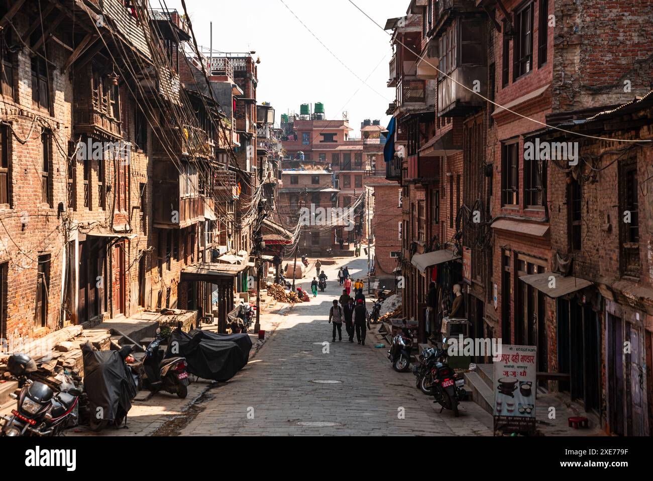View along a pedestrian road with traditional brick houses in the ...