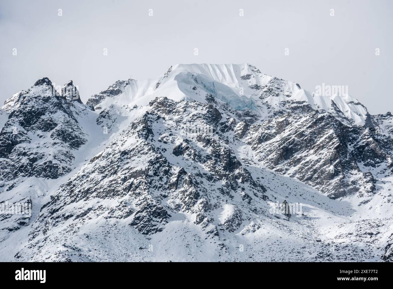 Close up of a towering snowy ice capped mountain range, Langtang Valley ...