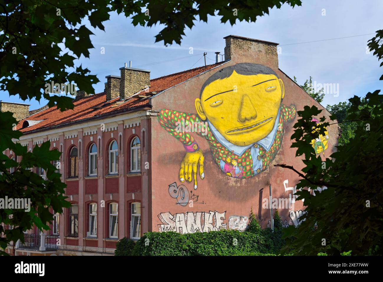 Mural painting by Os Gemeos, two Brazilian twin brothers, graffiti and ...