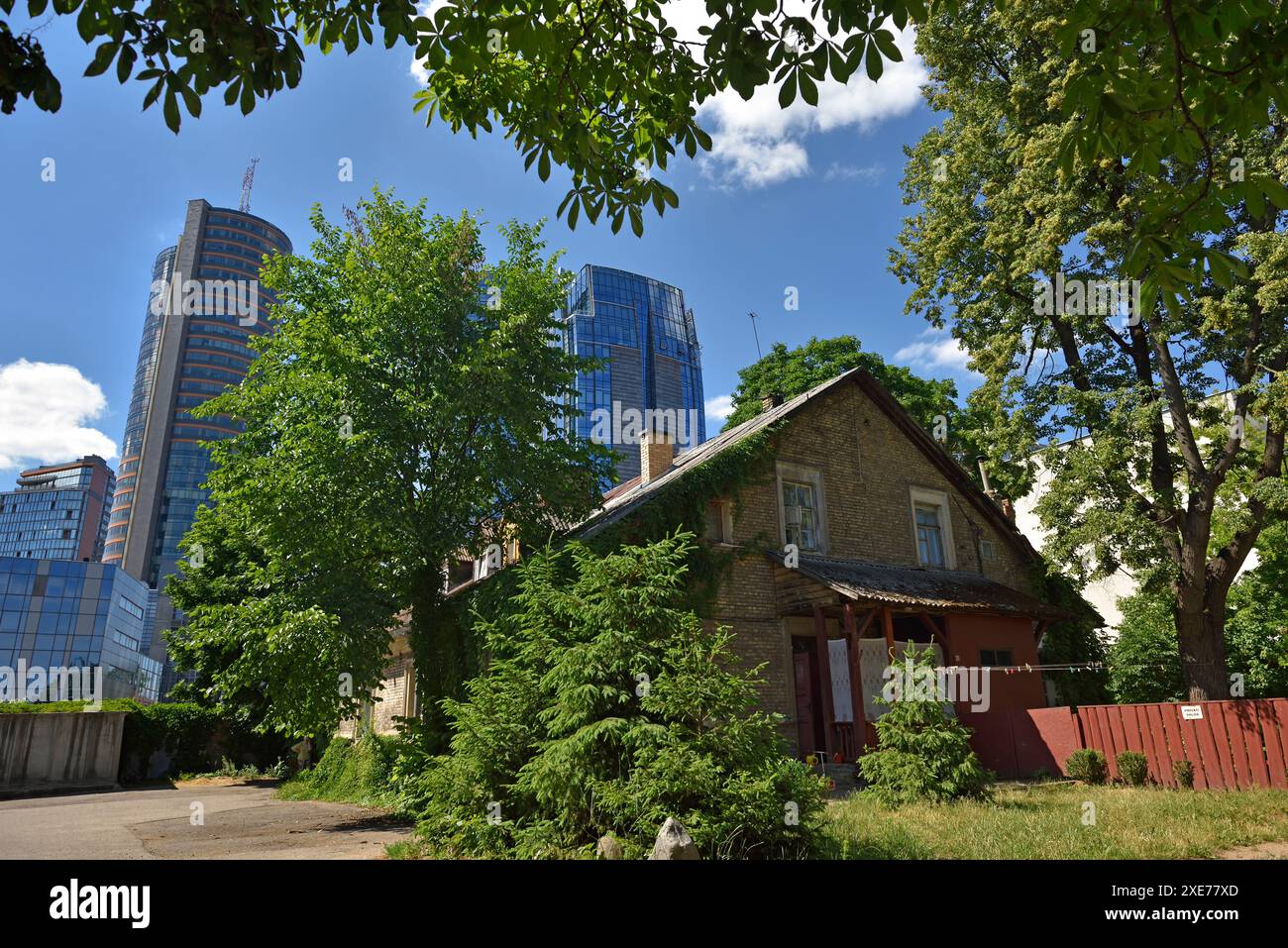 Old houses surrounded by modern office towers in the Snipiskes district ...