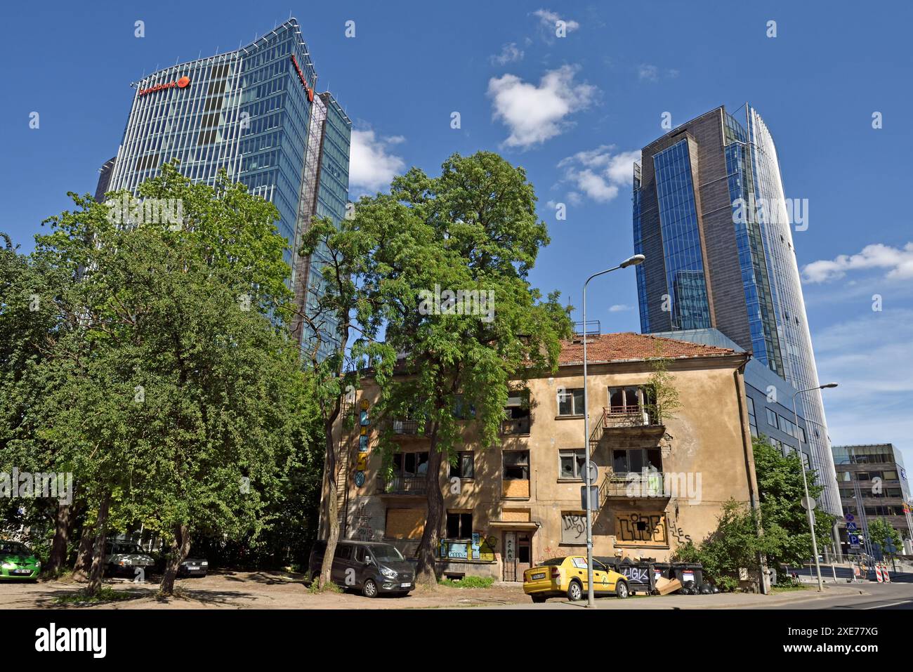 Old houses surrounded by modern office towers in the Snipiskes district ...
