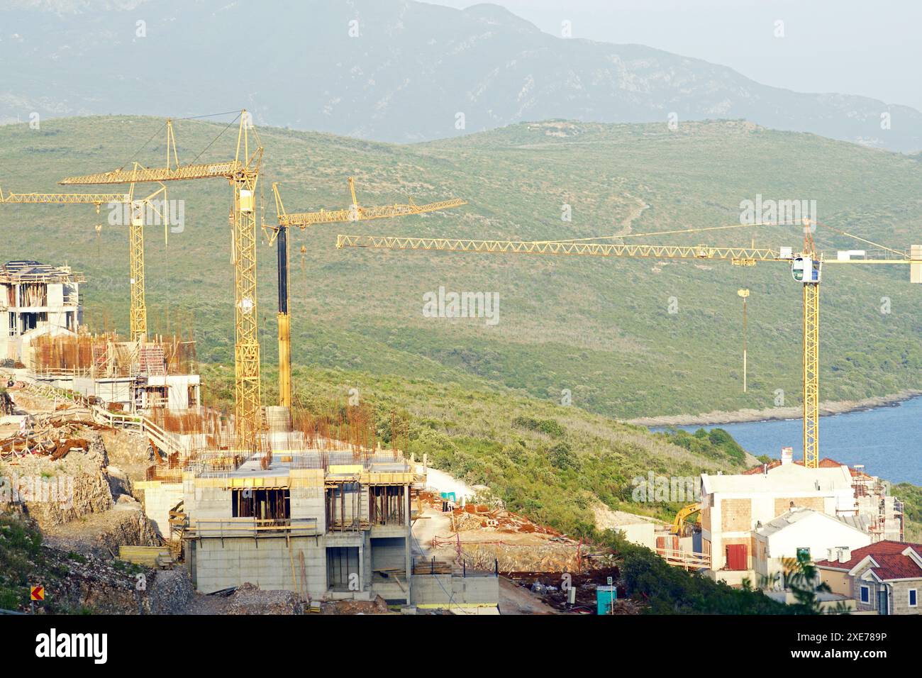 Crane building against backdrop mountains hi-res stock photography and ...