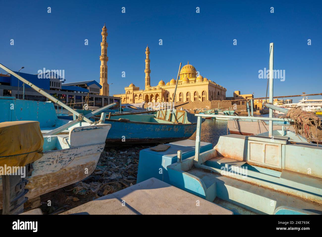 View of colourful wooden boats in Hurghada Harbour and Al Mina Mosque ...