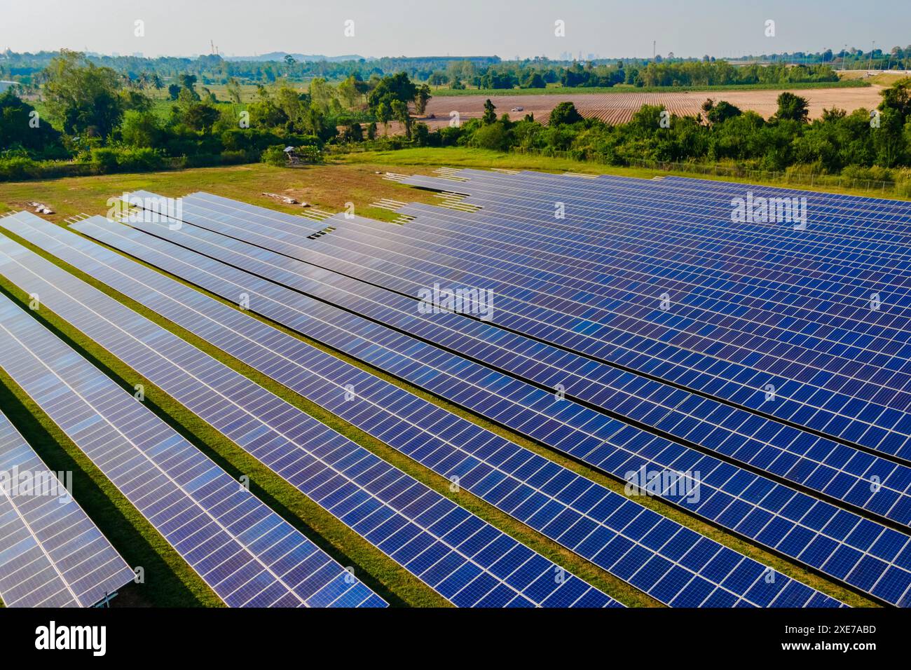 Solar panels sun power on the field in summer aerial view in Thailand ...