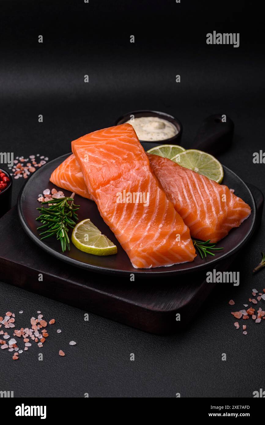 Fresh salmon red fish fillet with herbs hi-res stock photography and ...