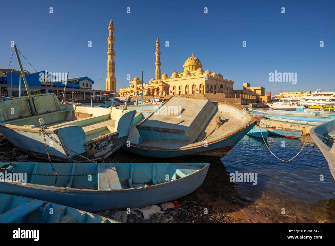 View of colourful wooden boats in Hurghada Harbour and Al Mina Mosque ...