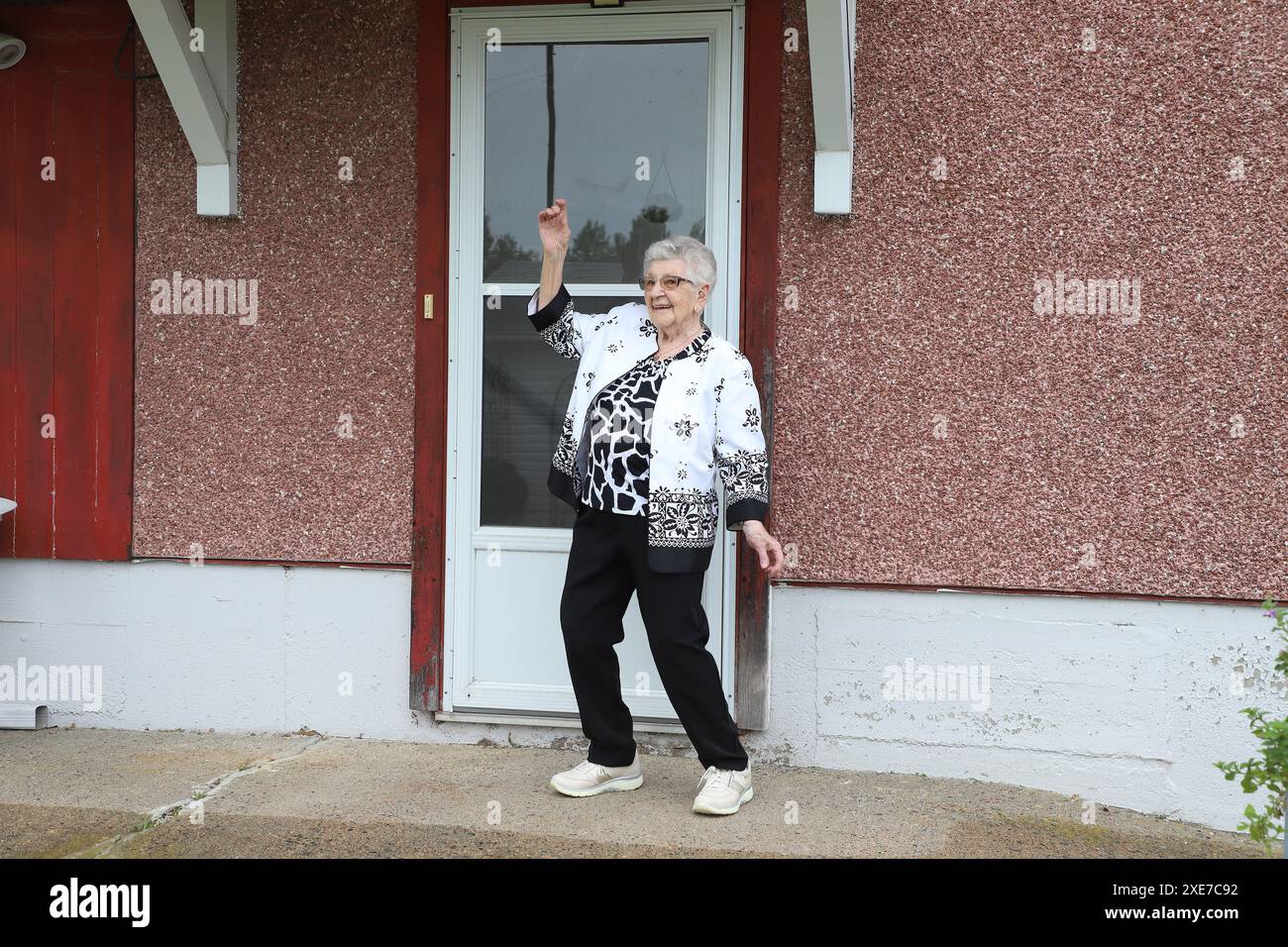 Angeline Charlebois, 105, does a dance outside her home in Levack, Ont., Saturday, June 22, 2024 ...