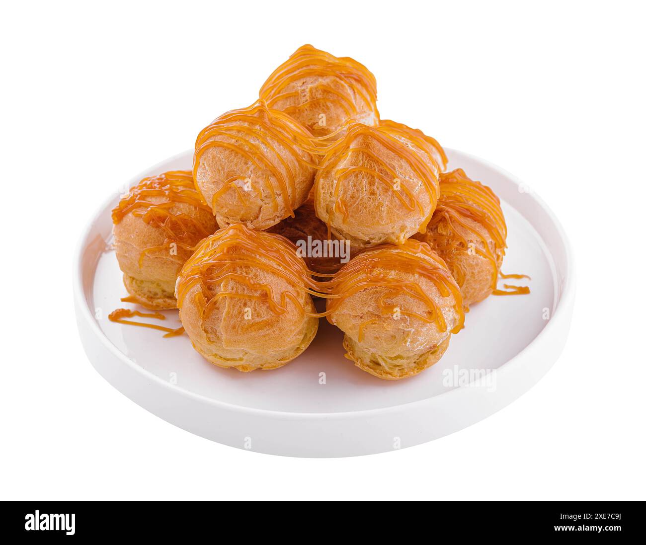 Tasty round eclairs with cream on white background Stock Photo - Alamy