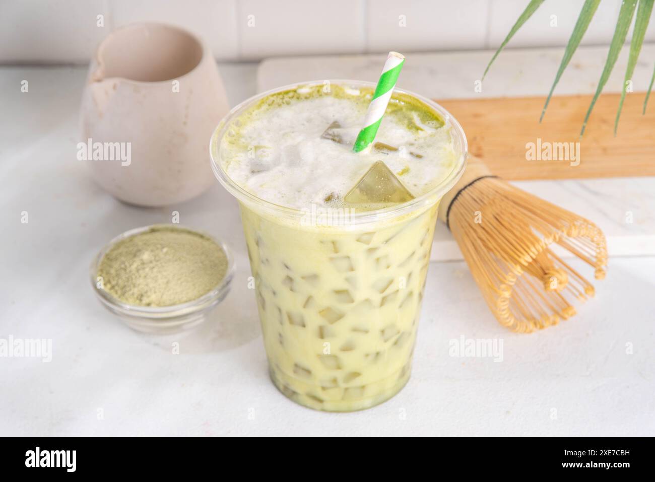 Cold green matcha latte drink. Delicious iced matcha green tea mixed ...