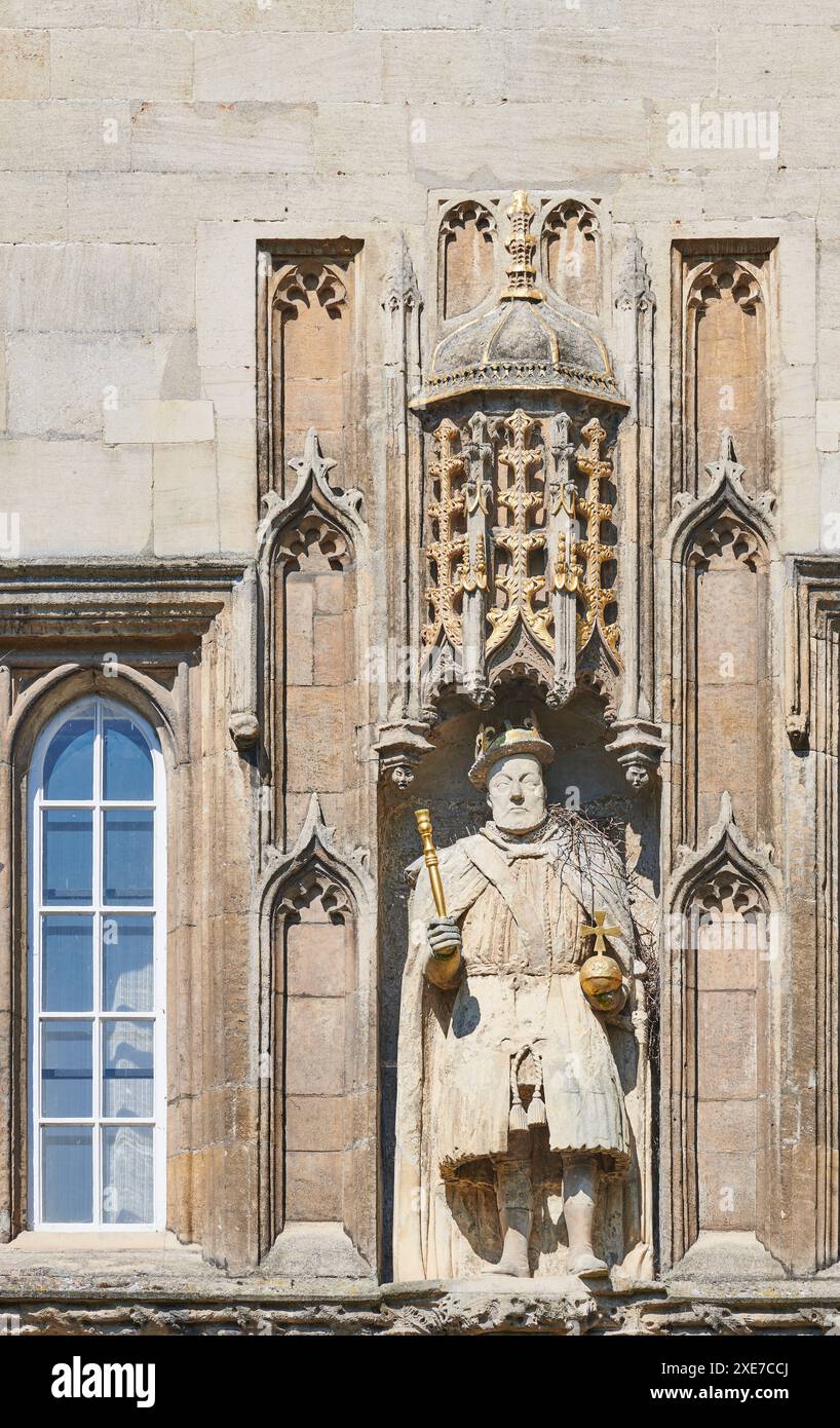 King Henry VIII statue, with chair leg and orb, on an outside wall of ...