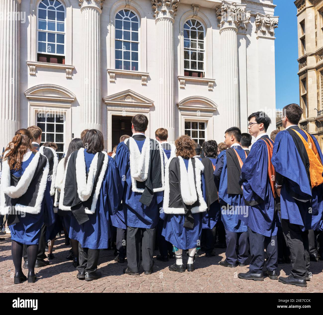 Trinity College graduands, University of Cambridge, in academic dress ...