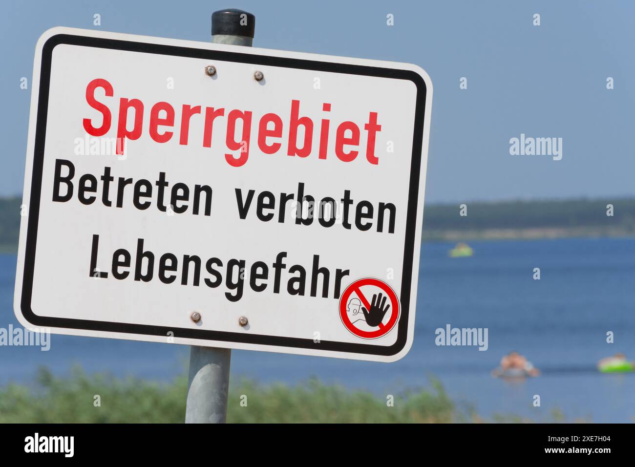 Bathing ban in the restricted area. Warning sign with the German text ...