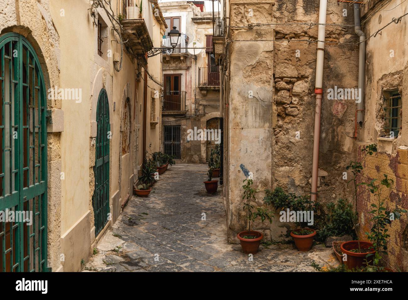 Shabby neighborhood street with run-down buildings in the Old Town of ...