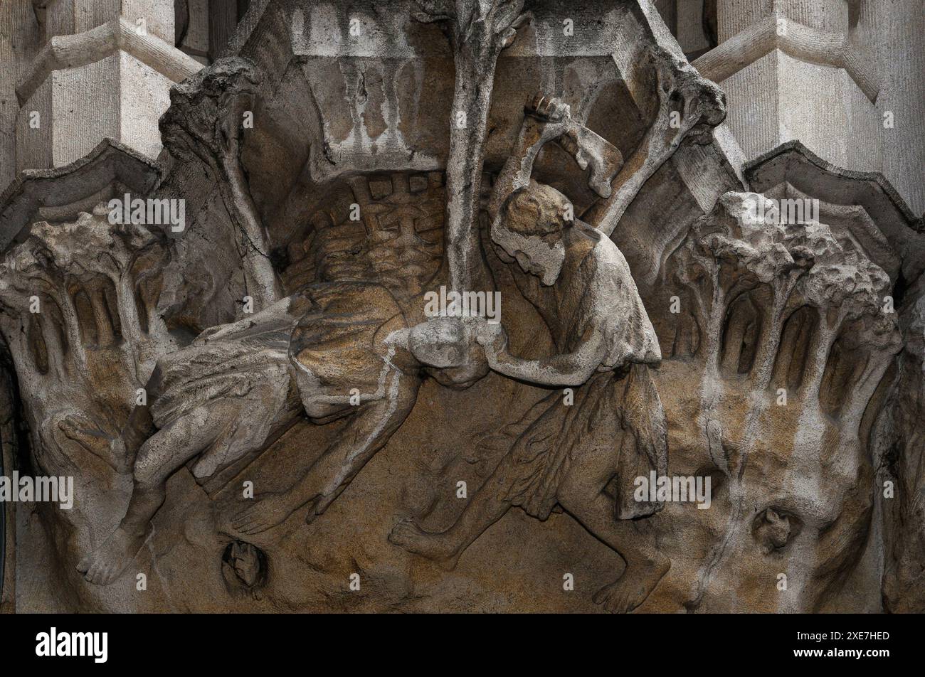 Cain and Abel. Man wields meat cleaver, machete or hatchet in scene ...