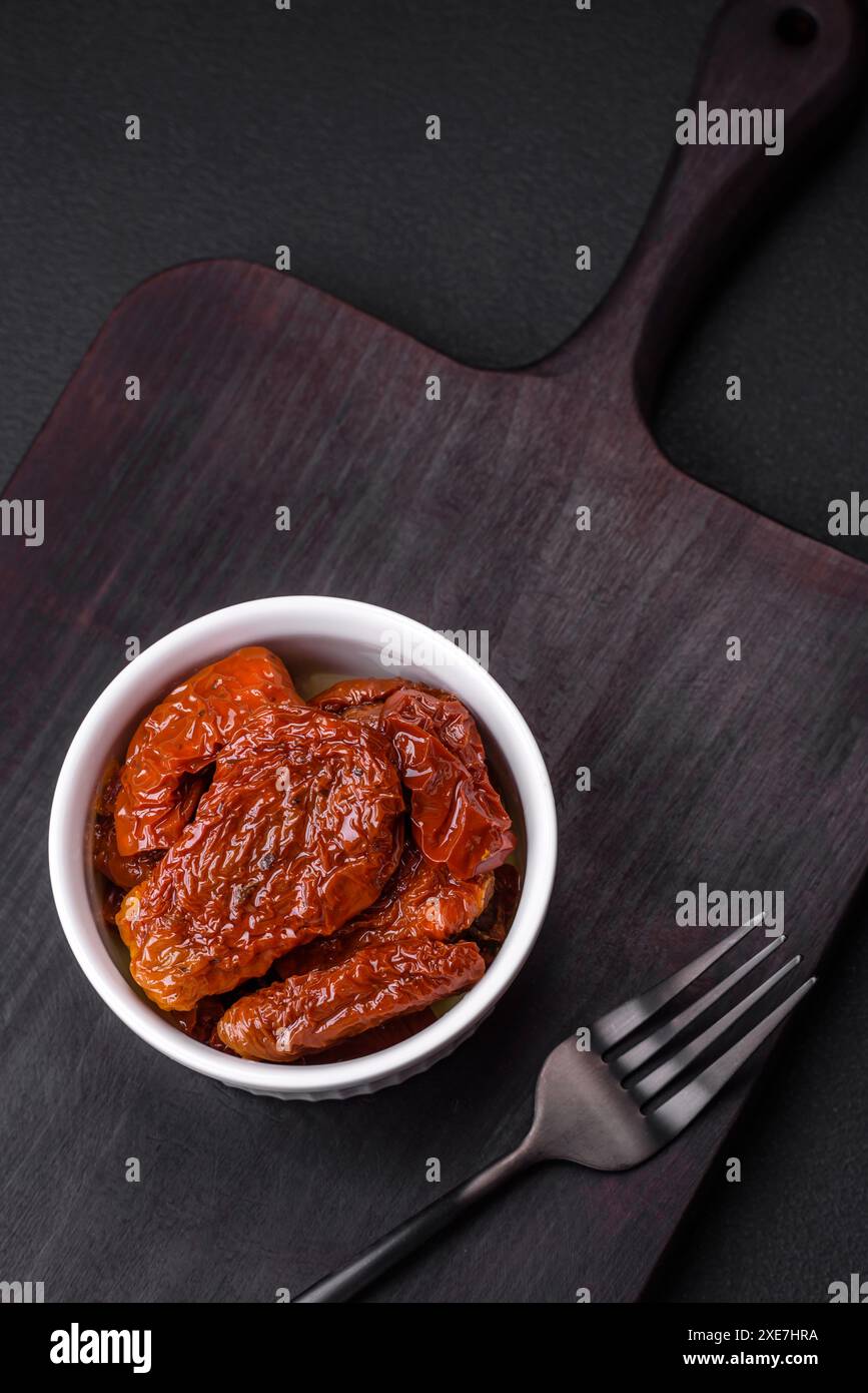 Delicious sun dried tomatoes in oil in a white ceramic bowl Stock Photo ...