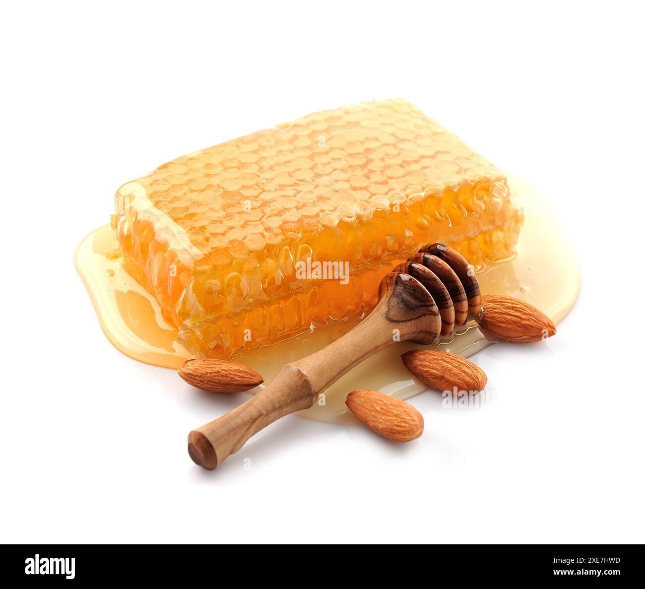 Honeycomb with almonds nuts Stock Photo - Alamy
