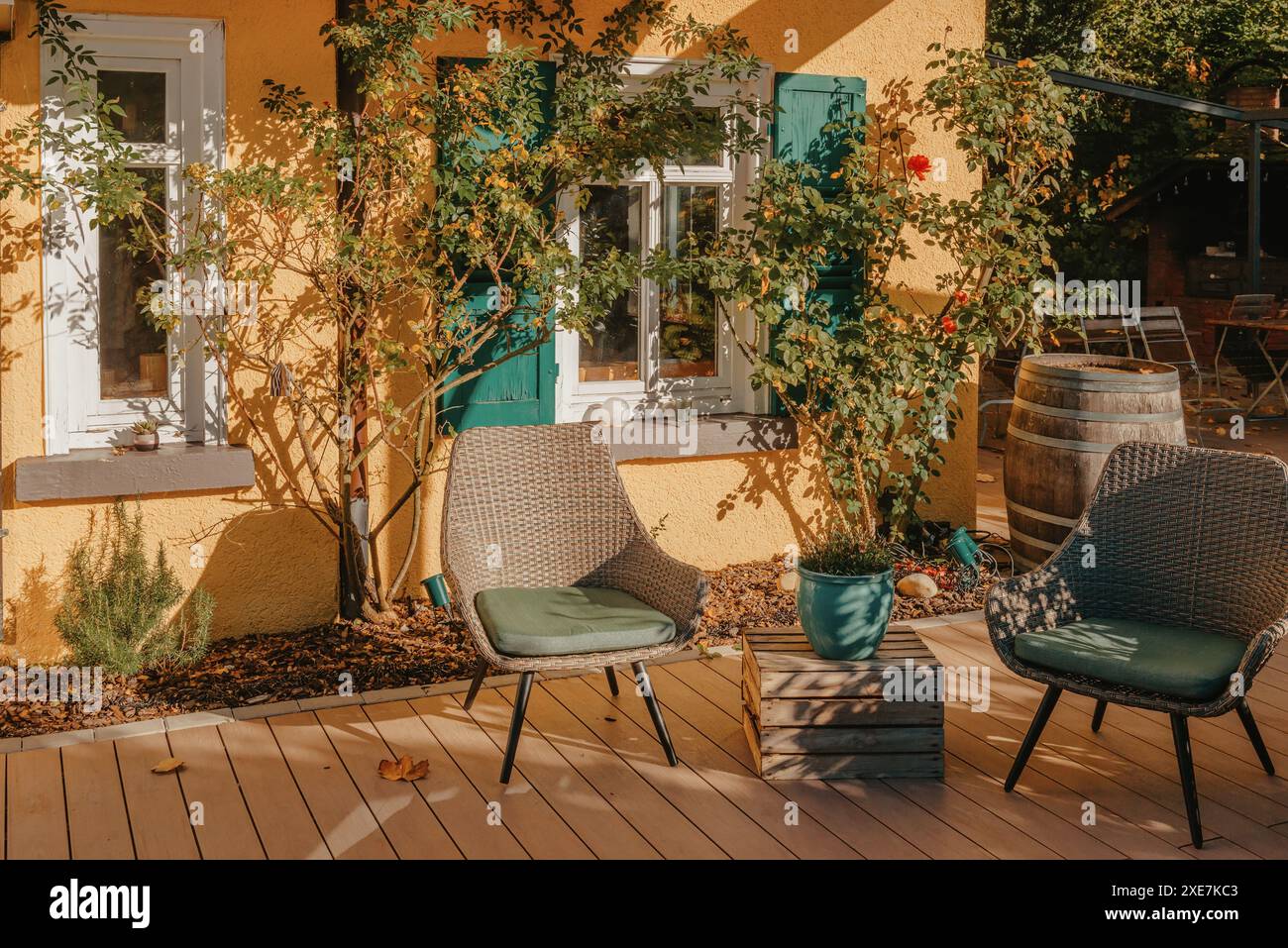 Image of a empty coffee tables arranged in backyard of a house. Autumn ...