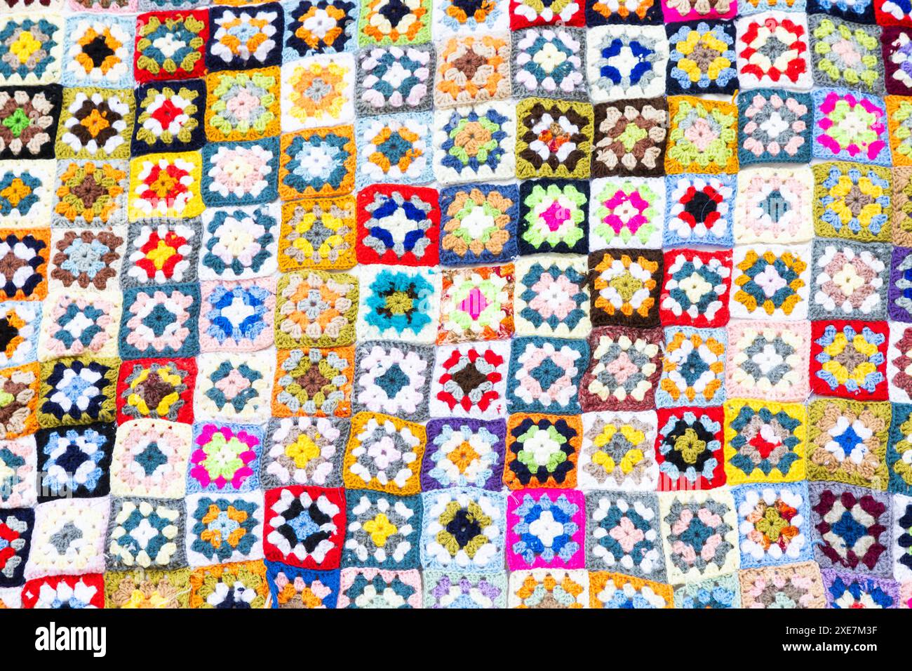 Multi colored blanket in wool, square geometric background, retro ...