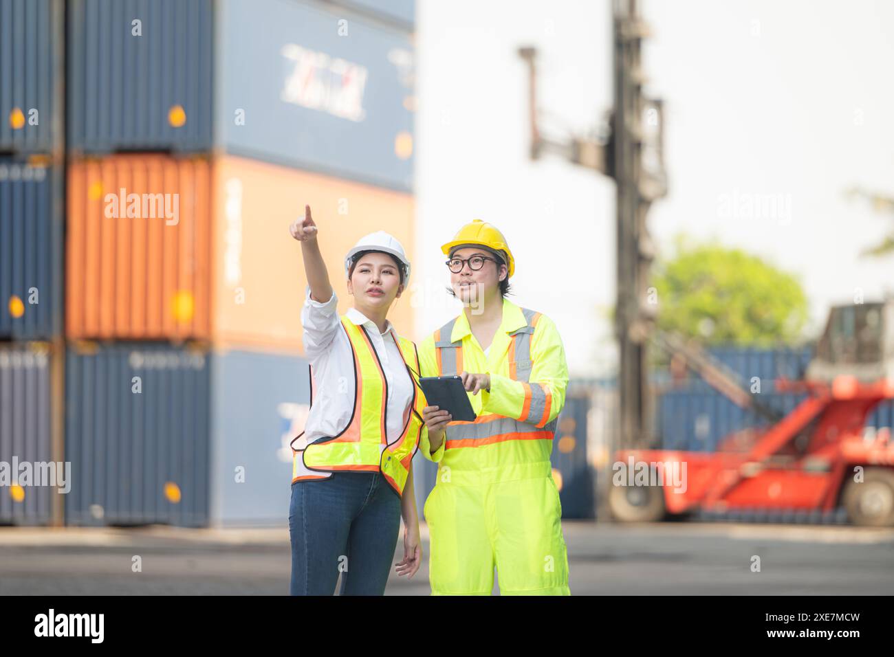 Portrait of Asian woman engineer and worker working with co-worker at ...