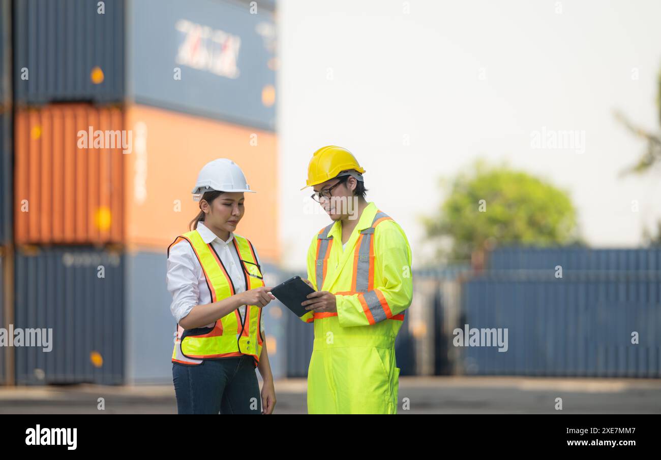 Portrait of Asian woman engineer and worker working with co-worker at ...