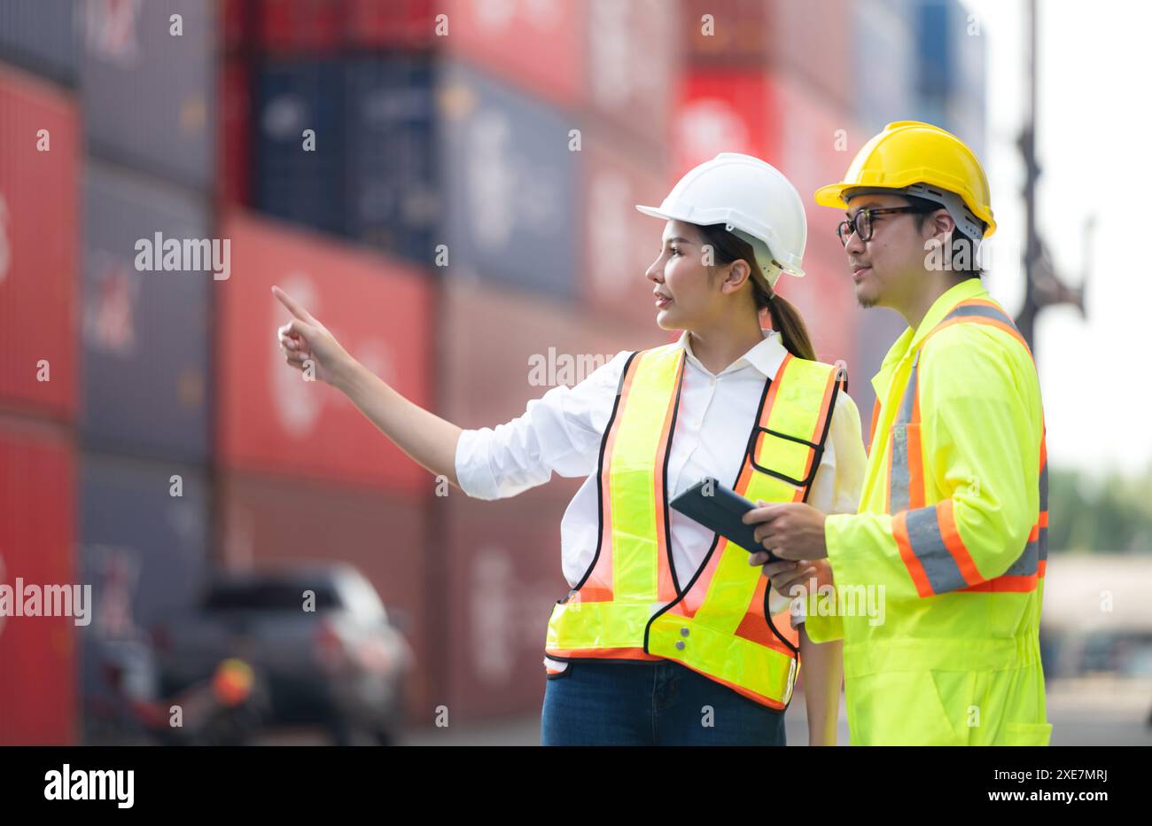Portrait of Asian woman engineer and worker working with co-worker at ...