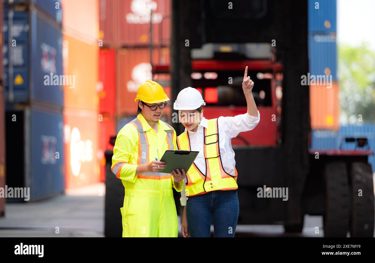 Portrait of Asian woman engineer and worker working with co-worker at ...