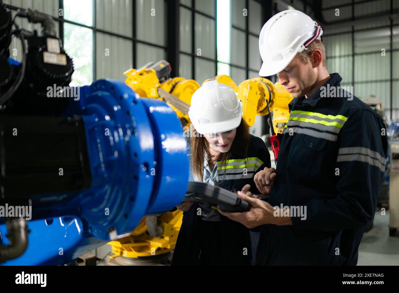 Female engineers maintenance robot arm hi-res stock photography and ...
