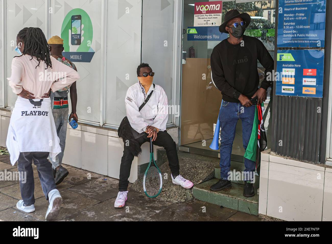 Protesters take cover, during the demonstration. Young protestors ...