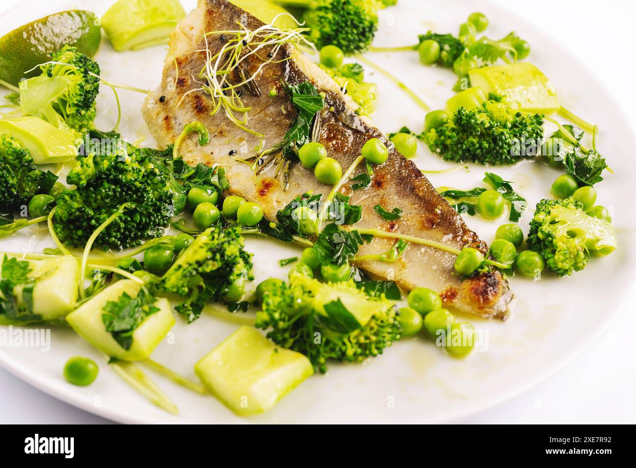Baked sea fish fillet with vegetables Stock Photo - Alamy