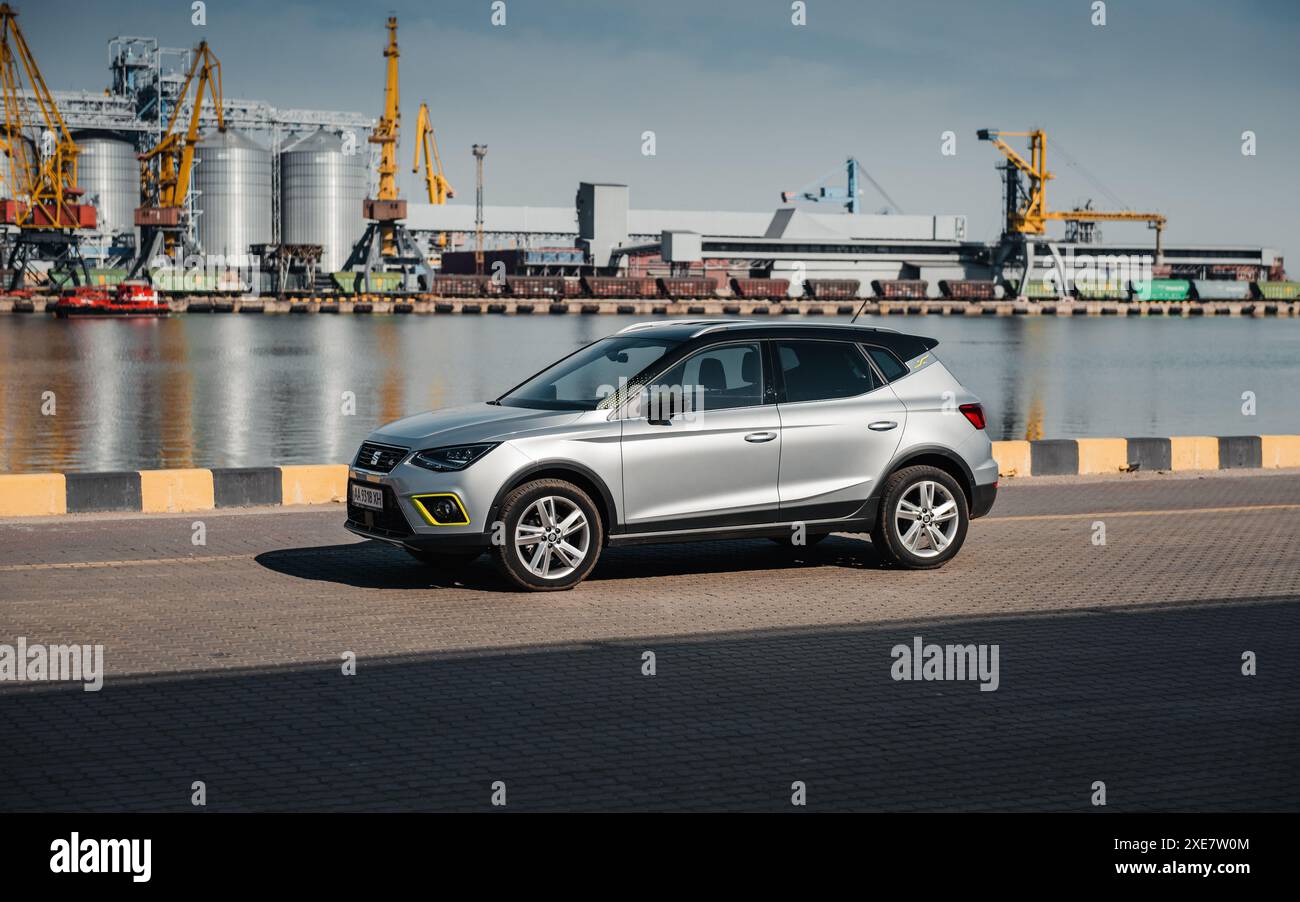 silver SEAT Arona parked along the wharf in sea port. Three quarter ...