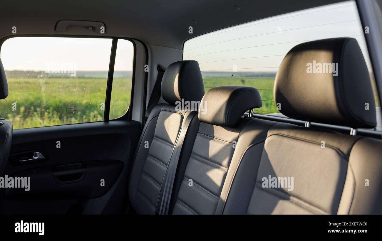 Rear row of seats in a pickup truck. Leather bench seat in vehicle and ...