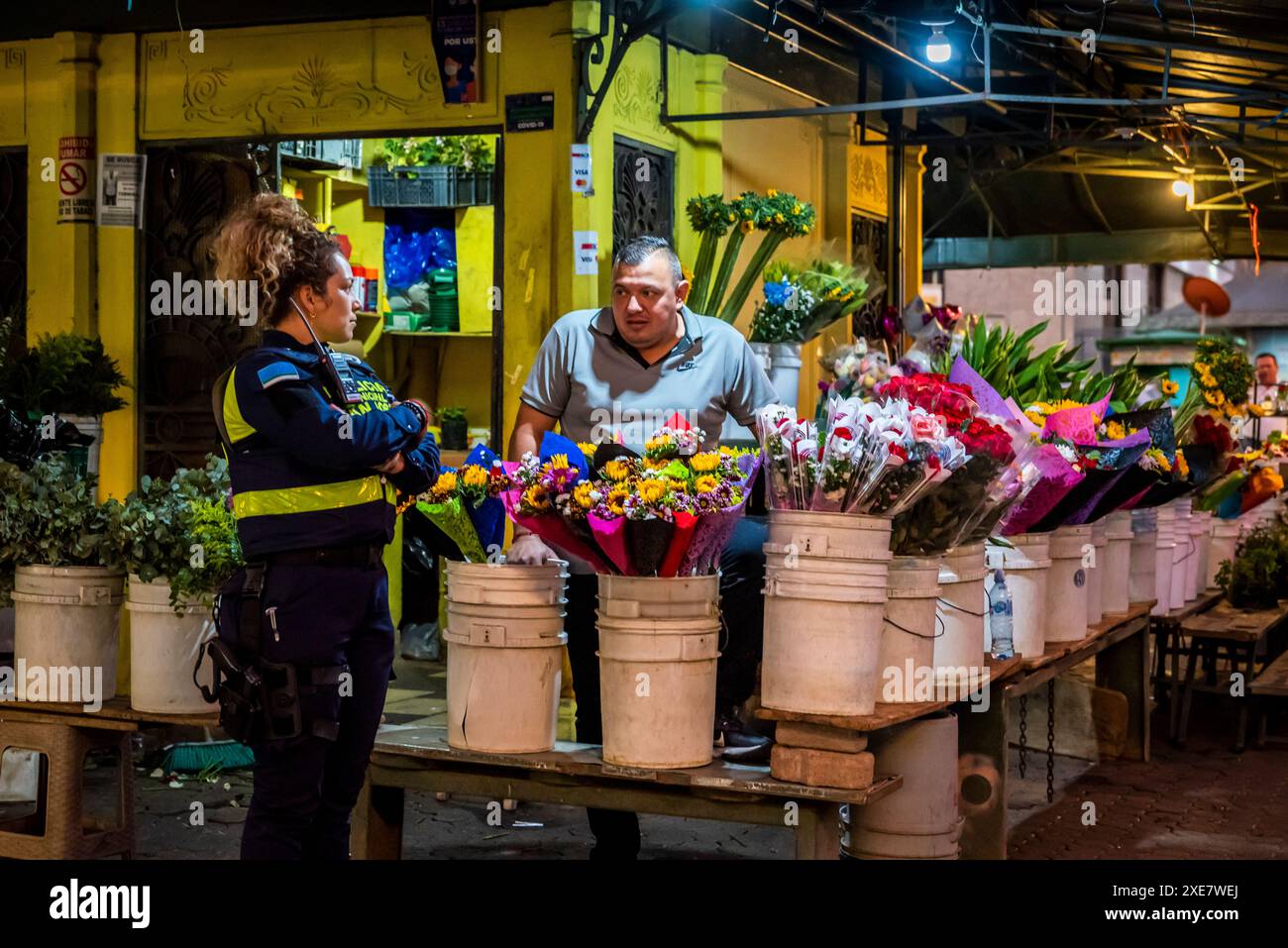 Flower shop seller and woman police officer, San Jose, Costa, Rica ...