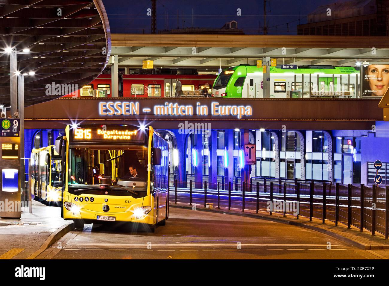 Buses of the Essen public transport company and regional trains at the ...