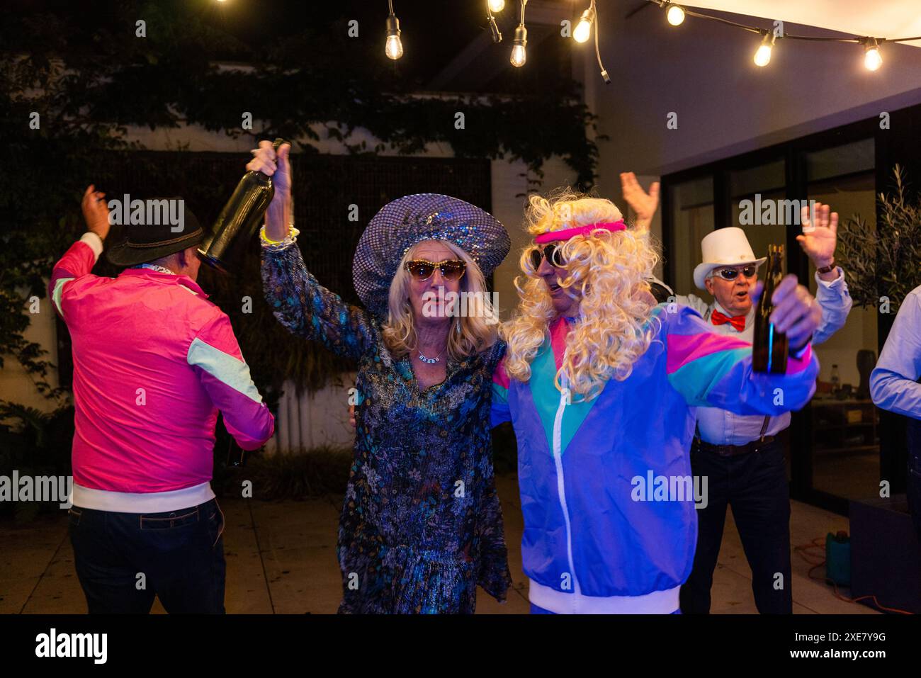 Retro Themed Party with Exuberant Dance Moves Stock Photo - Alamy