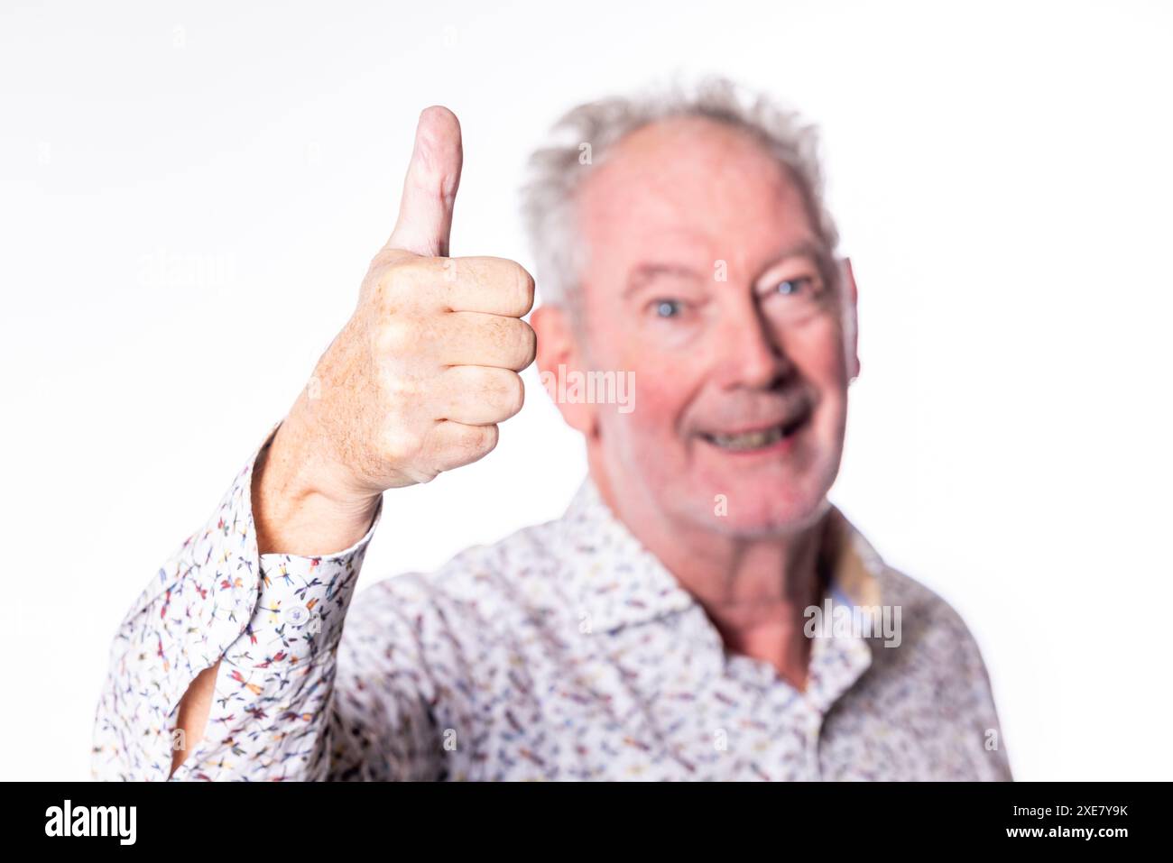 Senior Man Giving a Thumbs Up Gesture Stock Photo - Alamy