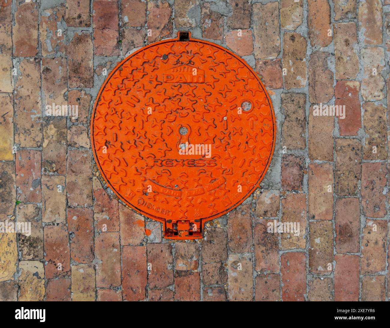 Road Town's Vibrant Identity: The Charm of Orange-Painted Manhole ...