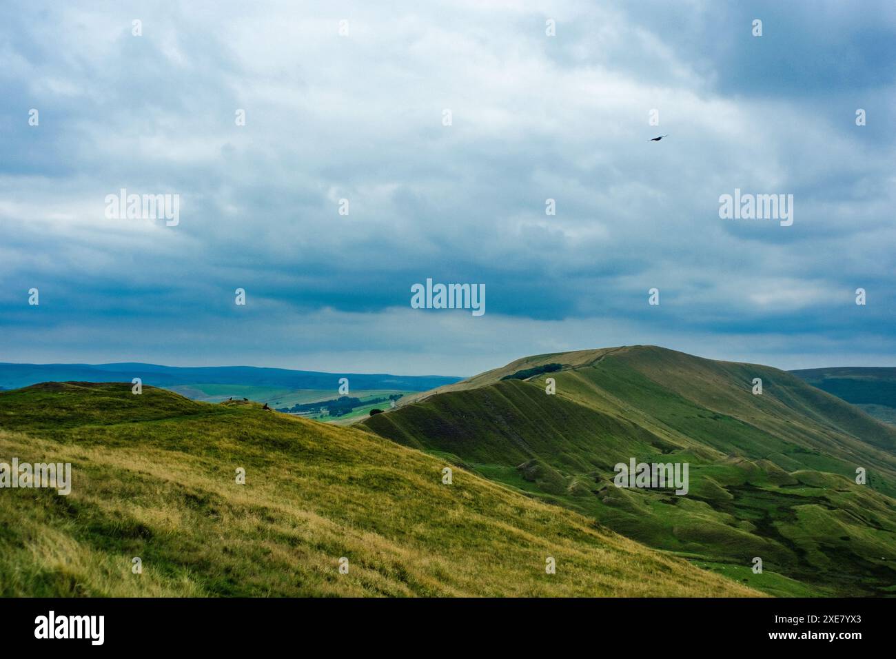 Green Peak District mountains below a moody skies on a cloudy afternoon ...