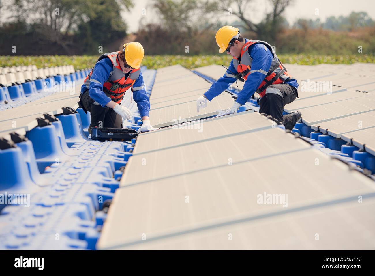Photovoltaic engineers work on floating photovoltaics. Inspect and ...