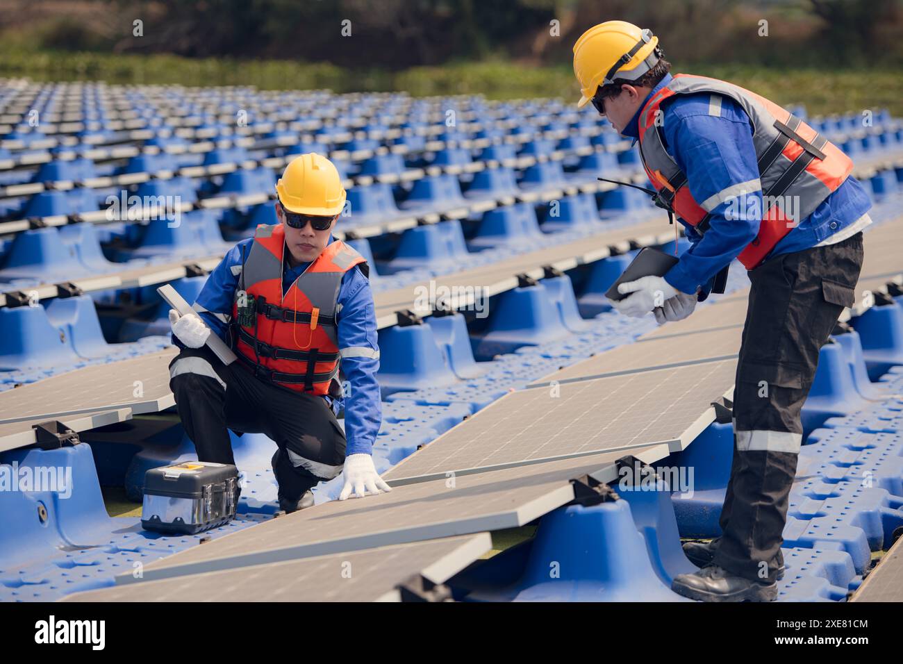 Photovoltaic engineers work on floating photovoltaics. Inspect and ...
