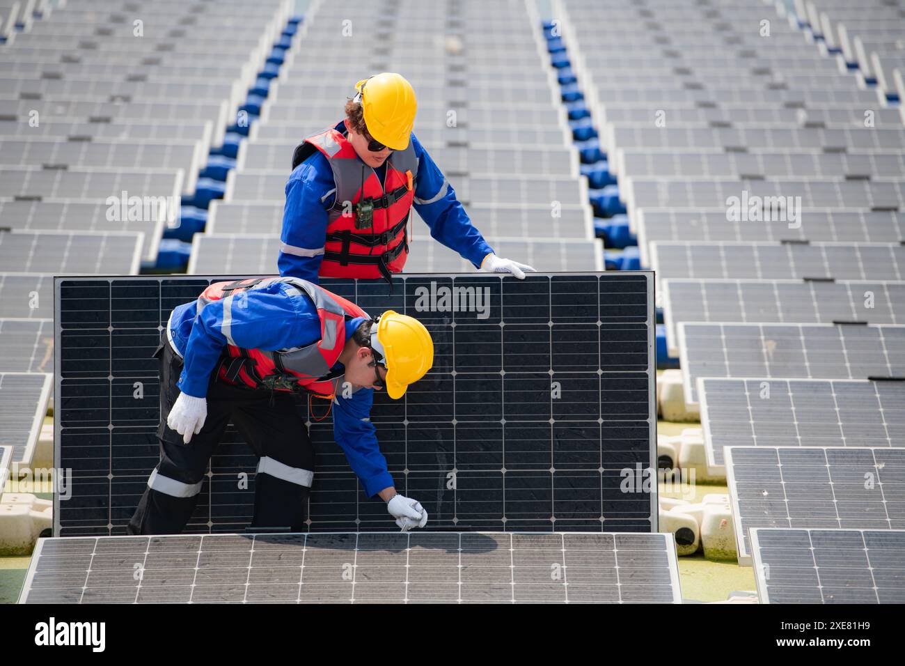 Photovoltaic engineers work on floating photovoltaics. Inspect and ...