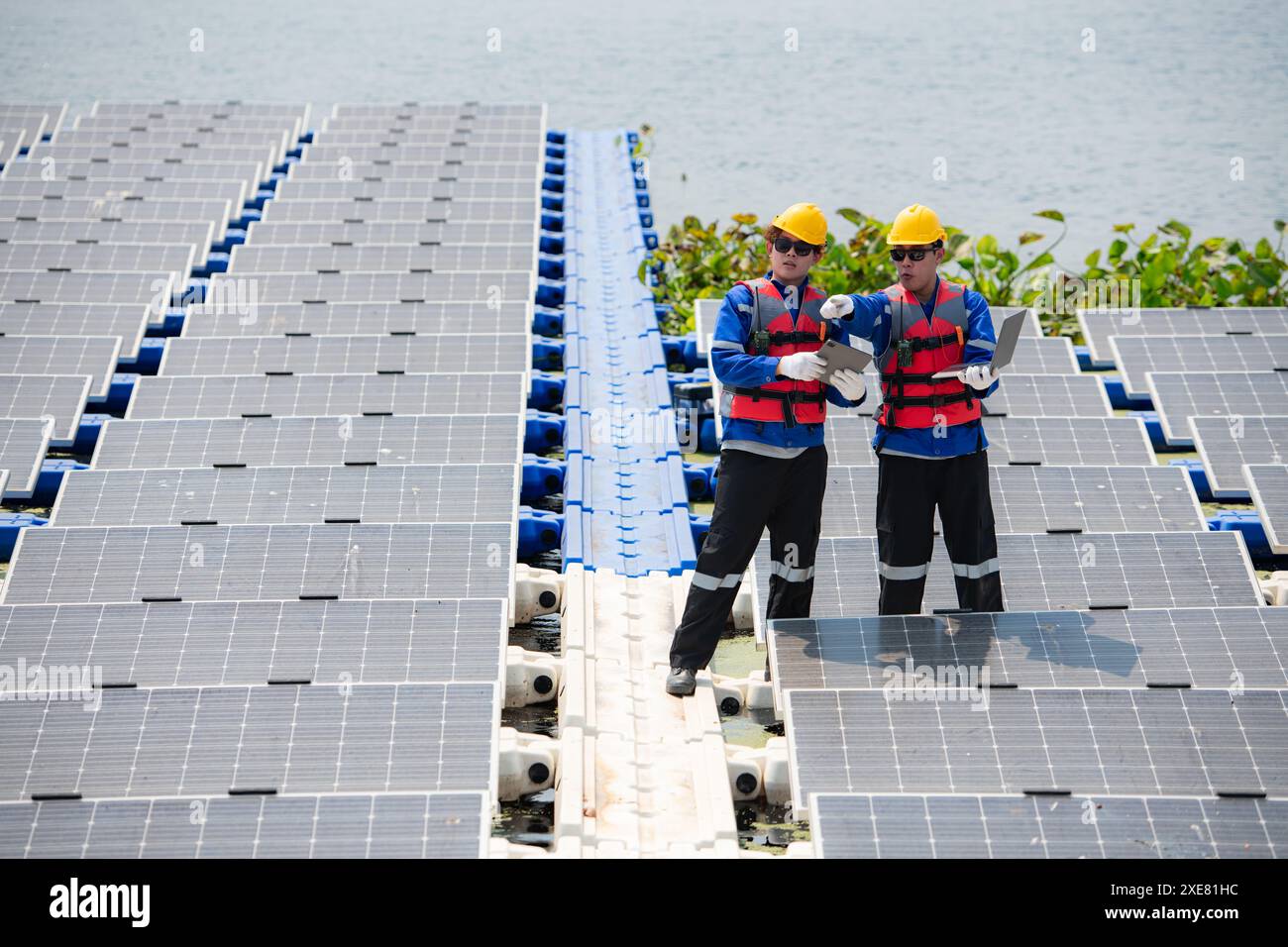 Photovoltaic engineers work on floating photovoltaics. Inspect and ...