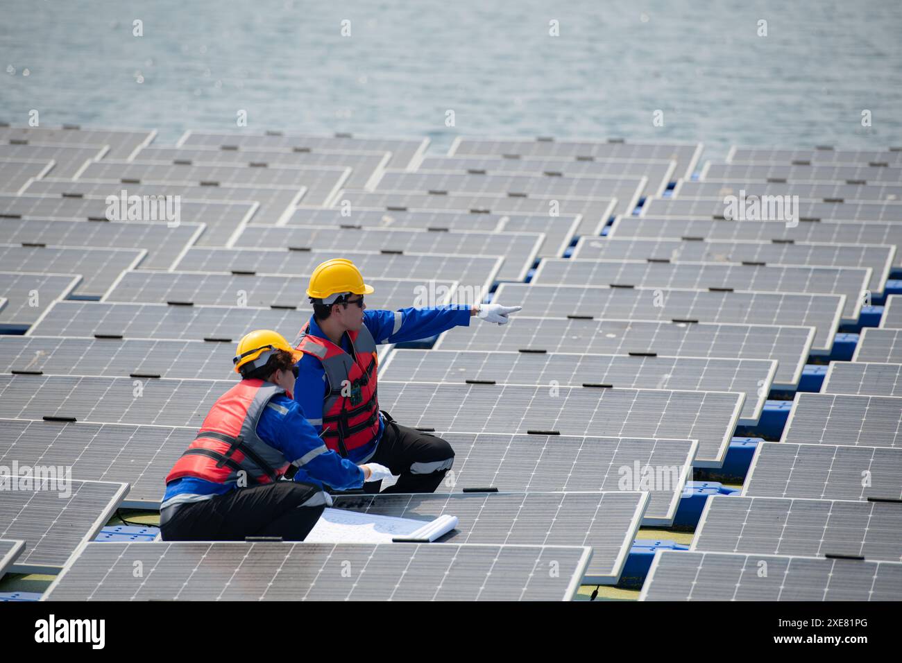 Photovoltaic engineers work on floating photovoltaics. Inspect and ...