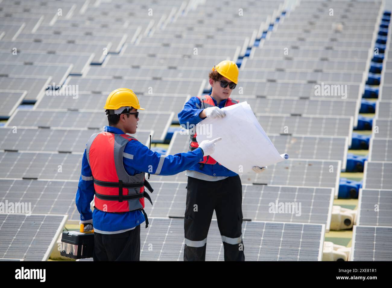 Photovoltaic engineers work on floating photovoltaics. Inspect and ...