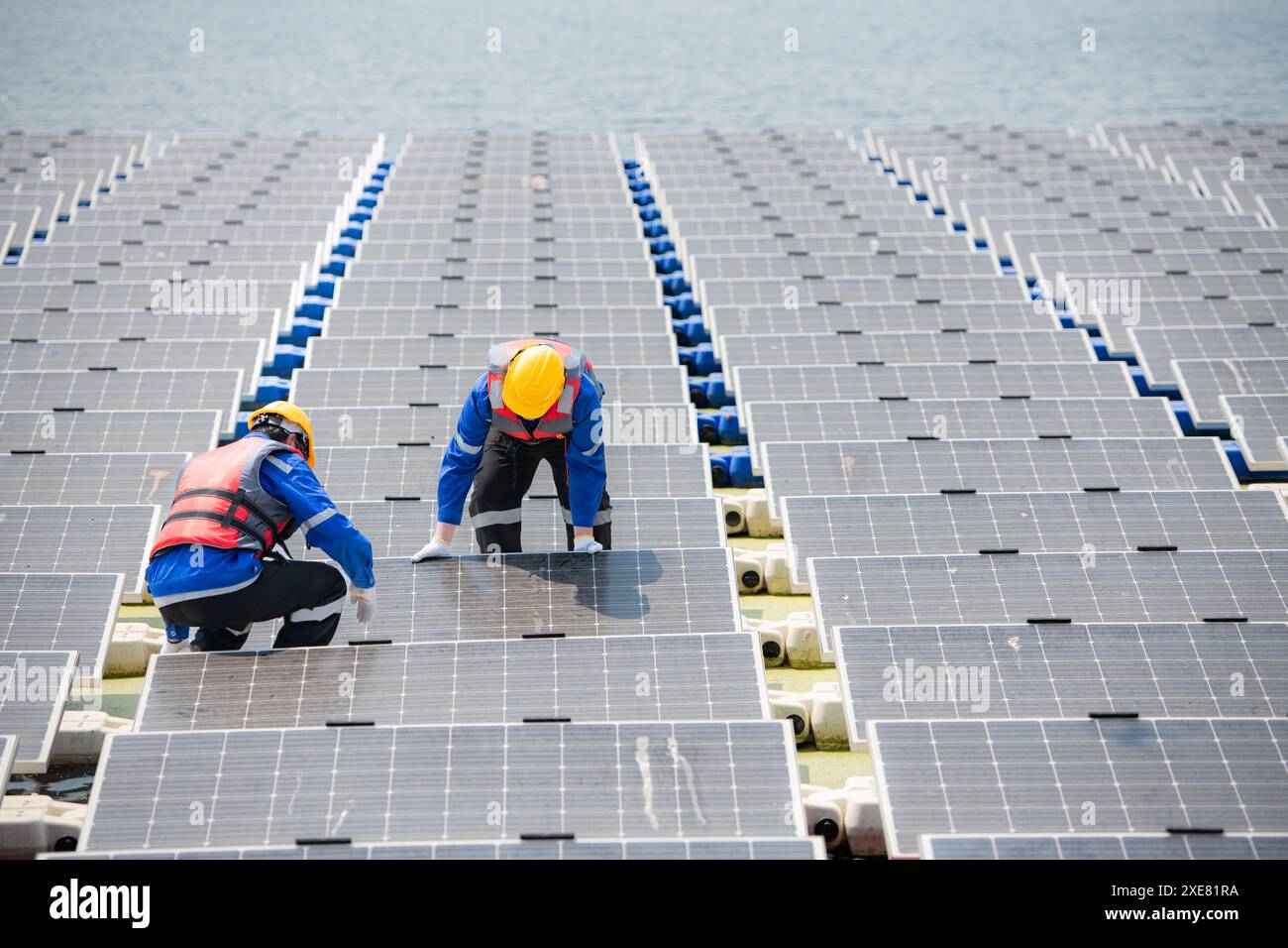 Photovoltaic engineers work on floating photovoltaics. Inspect and ...