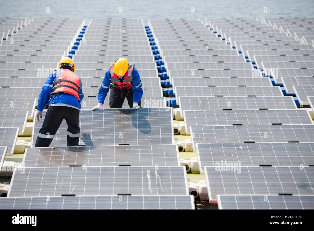 Photovoltaic engineers work on floating photovoltaics. Inspect and ...