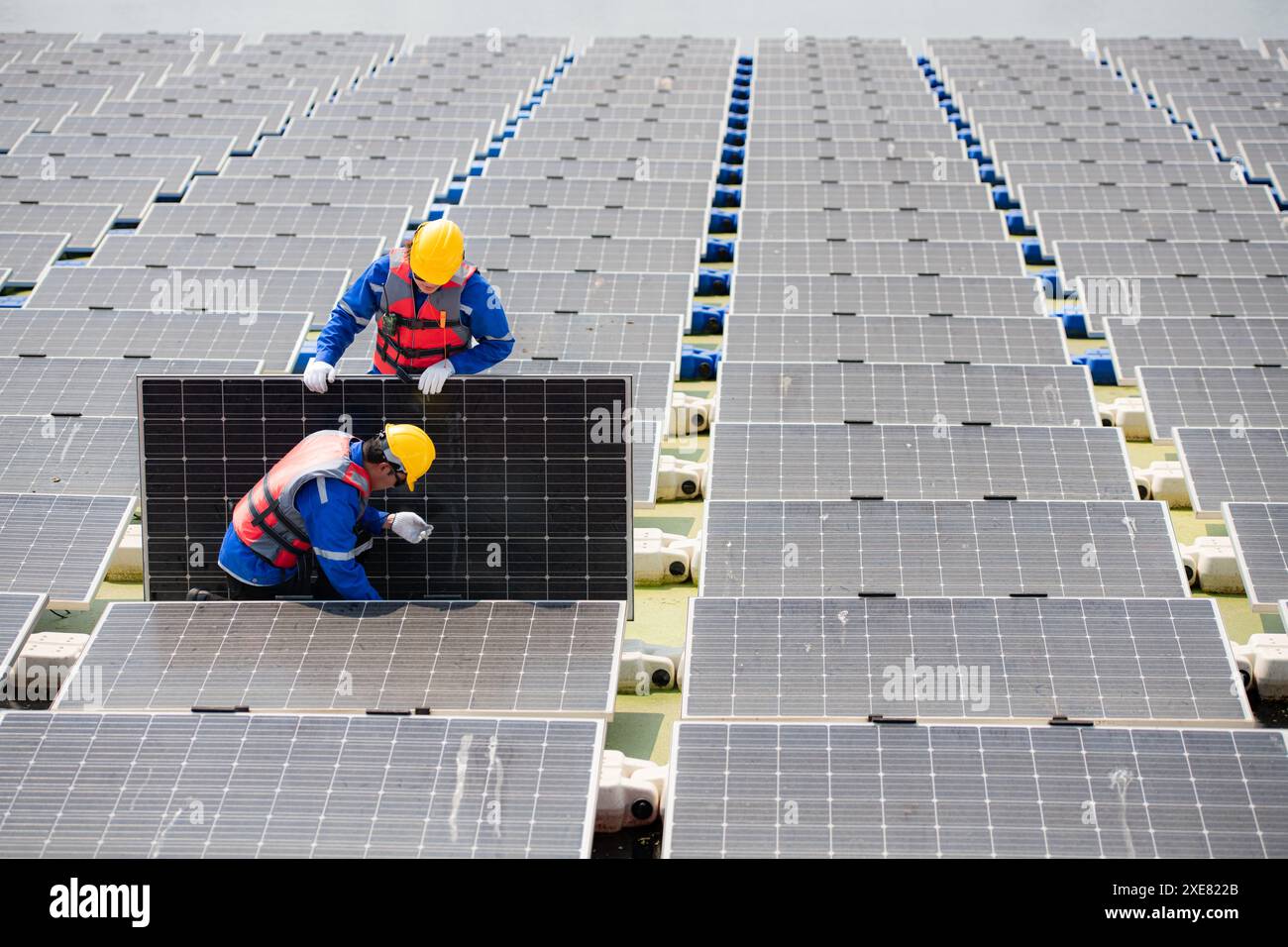 Photovoltaic engineers work on floating photovoltaics. Inspect and ...